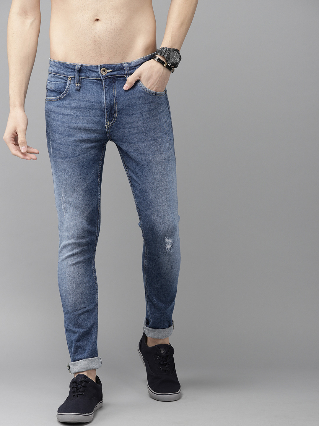 Buy Roadster Men Blue Slim Fit Low Rise Low Distress Stretchable Jeans ...