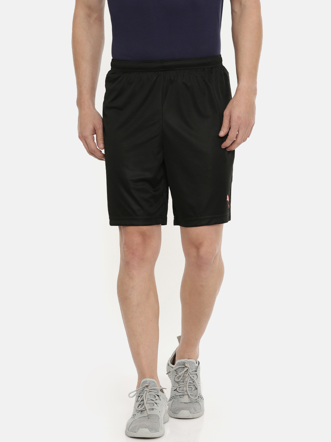 Buy Puma Men Black Solid Regular Fit DryCELL FtblPLAY Nrgy Red Sports ...
