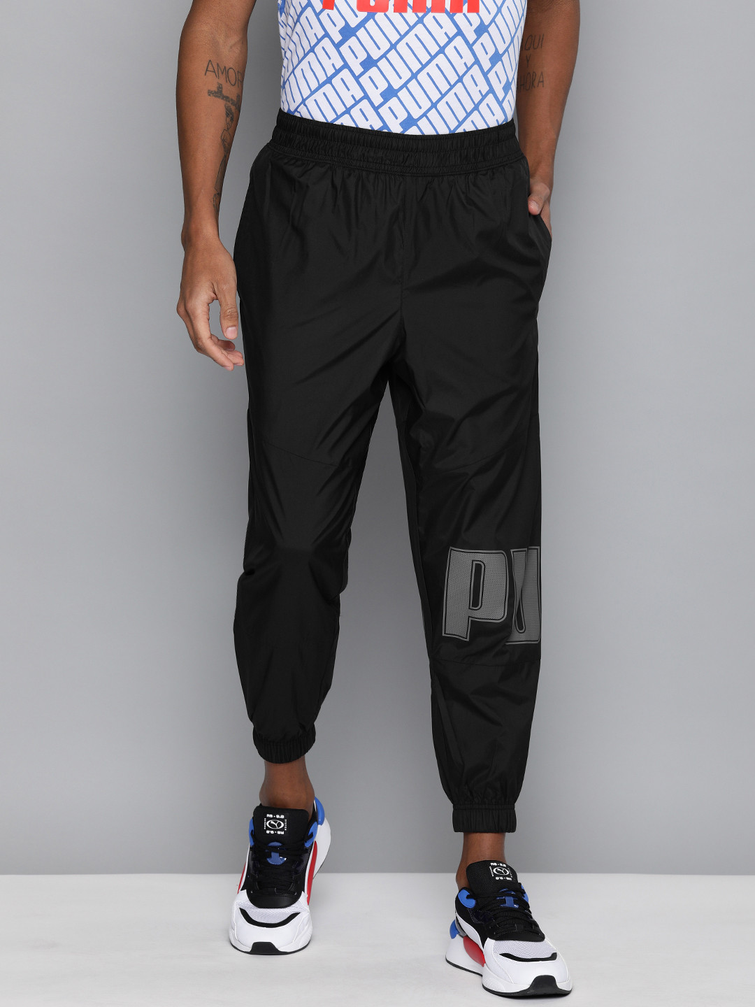 Buy Puma Men Black Solid Collective Woven WINDCELL Joggers - Track ...