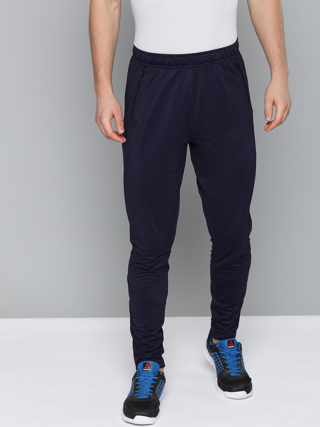 Buy Reebok Men Navy Blue Solid Slim Fit TS Speedwick Knitted Training Track Pants - Track Pants ...