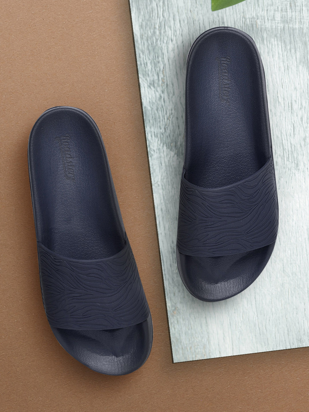 Buy Roadster Men Navy Blue Self Design Sliders - Flip Flops for Men ...