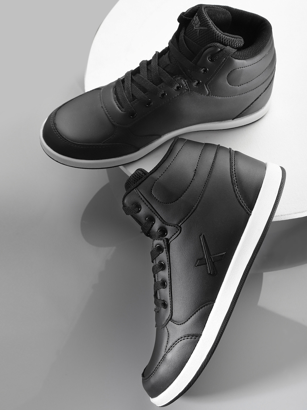 Buy HRX By Hrithik Roshan Black Solid Mid Top Skate Street Sneakers ...