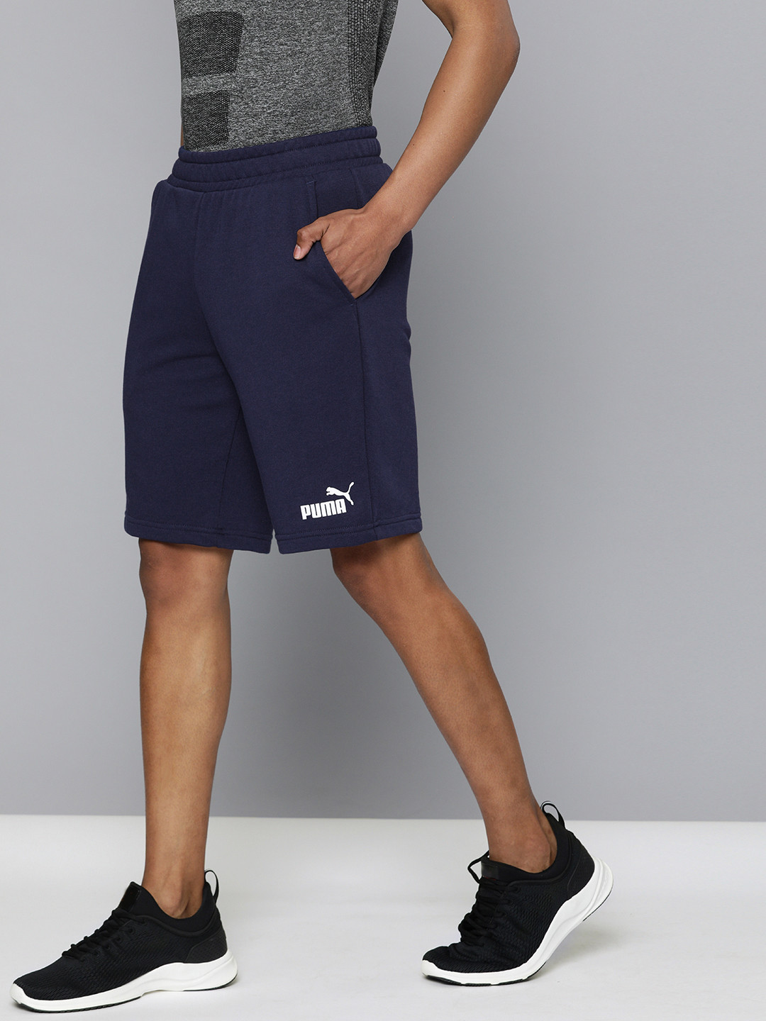 Buy Puma Men Navy Blue Solid Regular Fit ESS 10" Sports Sustainable ...