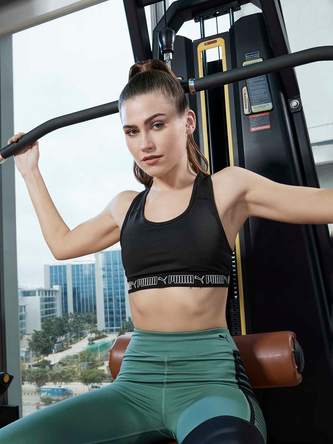 Buy Puma Women Black Solid Mid Impact Elastic Training Bra 52030201 ...