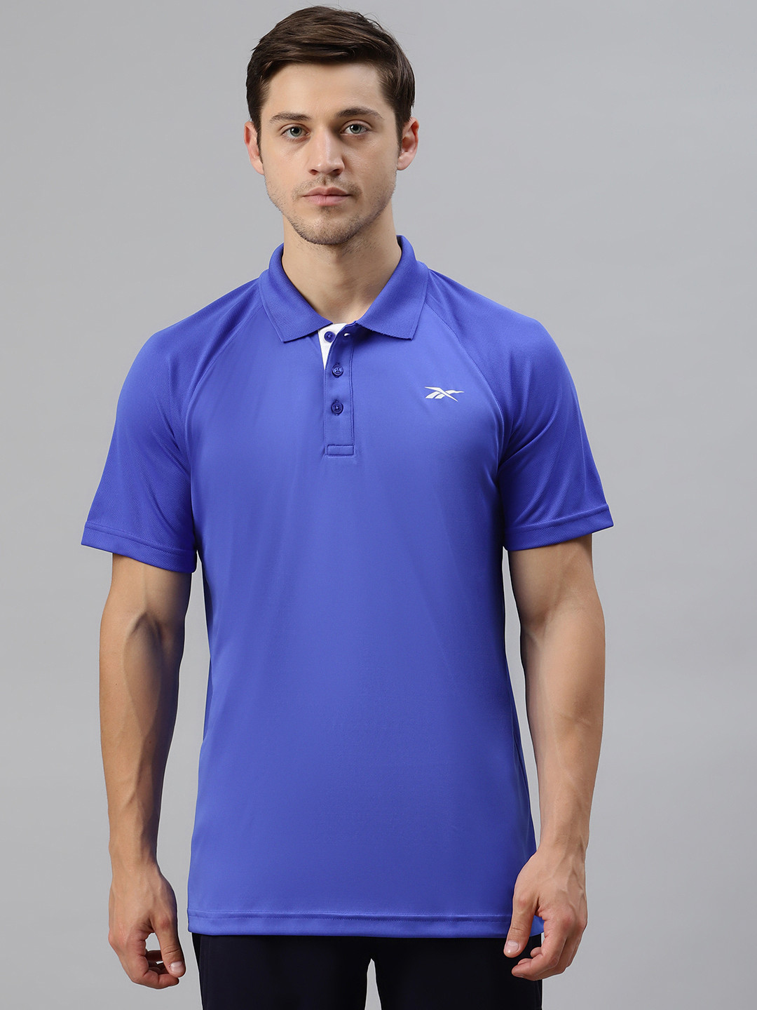 Buy Reebok Men Blue Solid Recycled Polyester Raglan Polo T Shirt ...