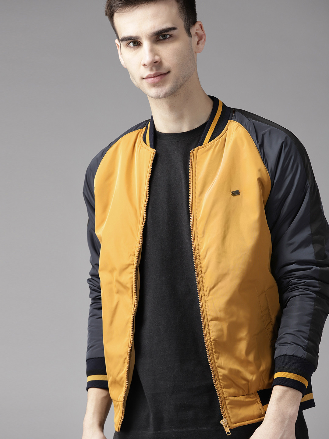 Buy Roadster Men Mustard Yellow & Navy Blue Solid Varsity Jacket ...