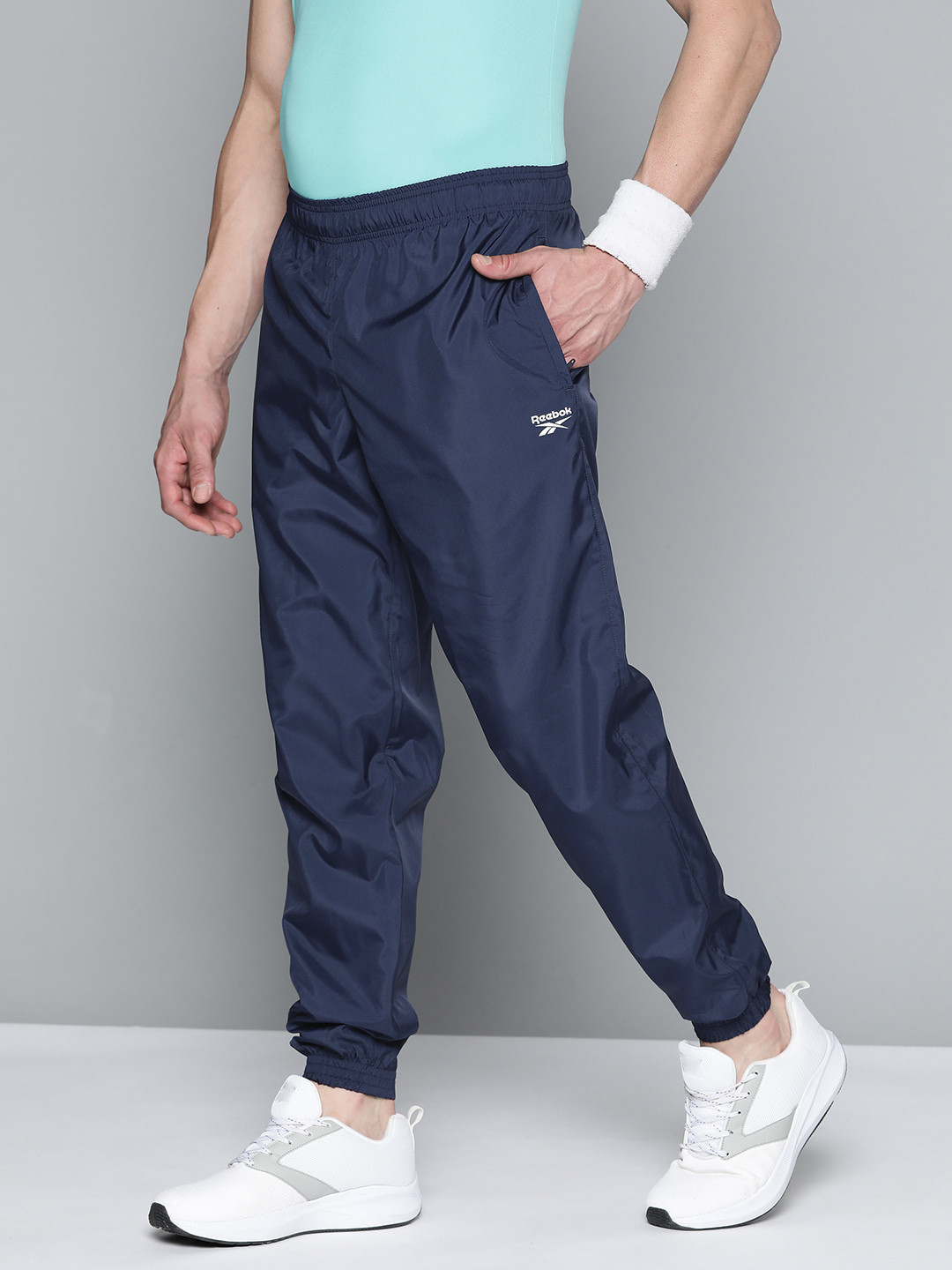 Buy Reebok Woven Speedwick Technology Solid Training Track Pants ...