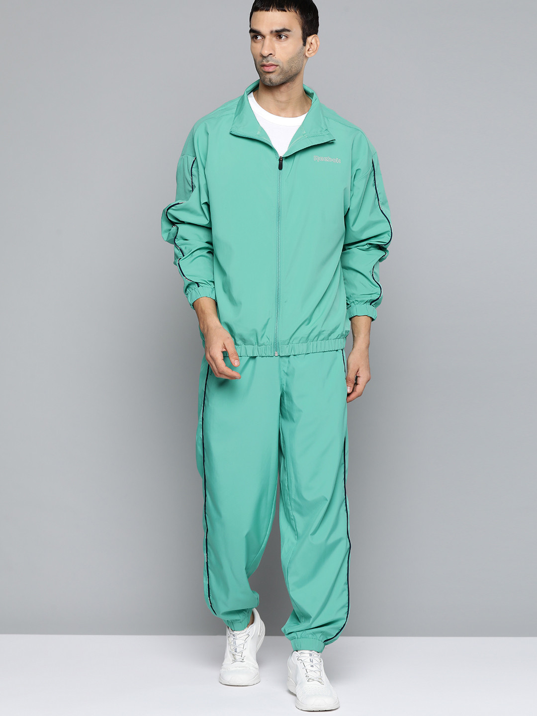 Buy Reebok Men Green Solid TE PIPING TRACKSUIT - Tracksuits for Men ...