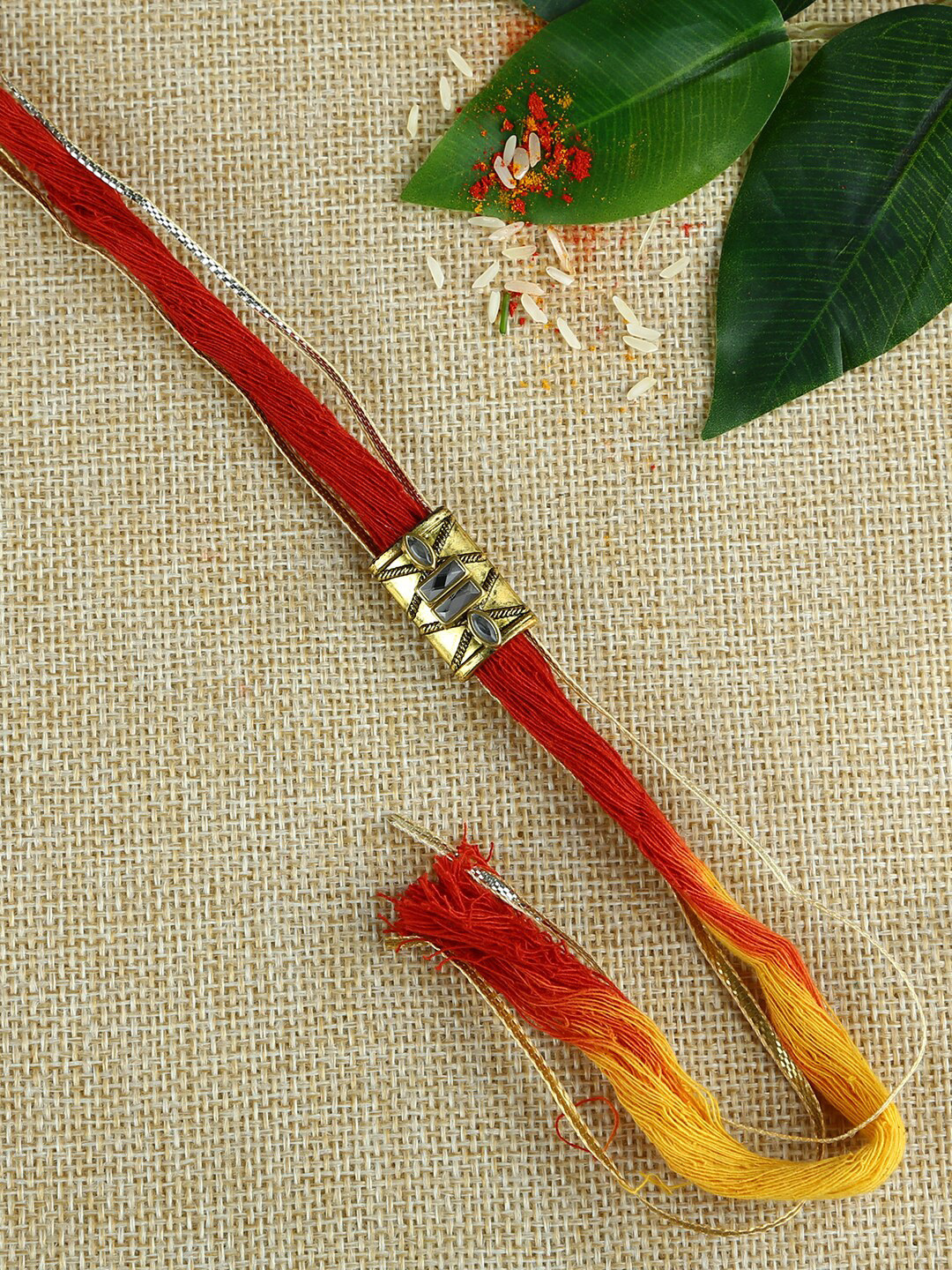 Buy Aapno Rajasthan Antique Gold Toned & Red Handcrafted Rakhi - Rakhi ...