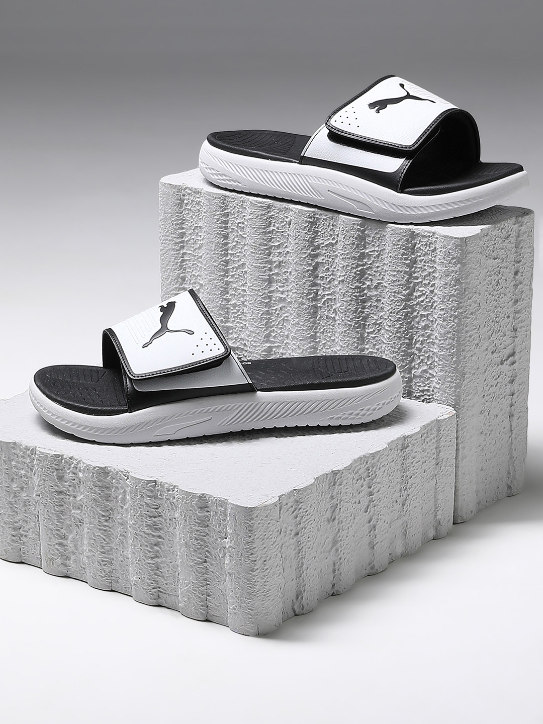 Buy Puma Men White & Black Colourblocked Softride Sliders - Flip Flops ...