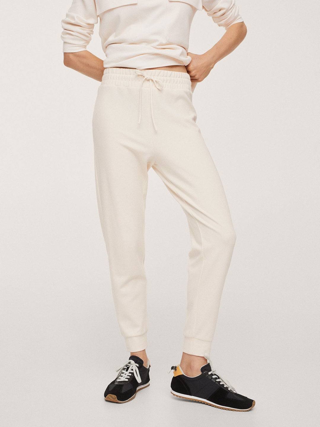 Buy MANGO Women Cream Coloured Solid Joggers - Trousers for Women ...