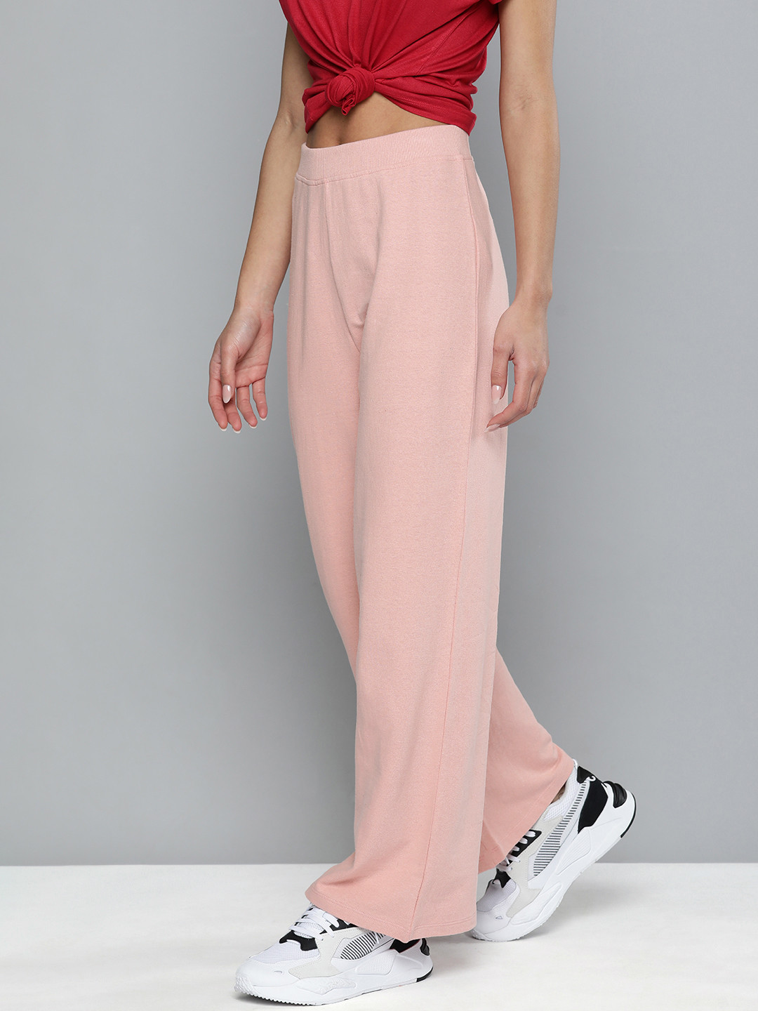 Buy Harvard Women Pink Solid Regular Fit Mid Rise Flared Track Pants ...