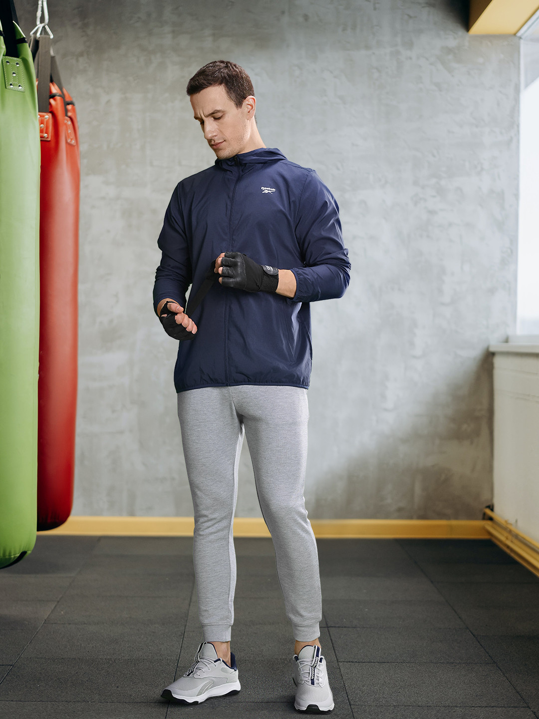 Buy Reebok Men Navy Blue Solid Training Sporty Jacket - Jackets for Men ...