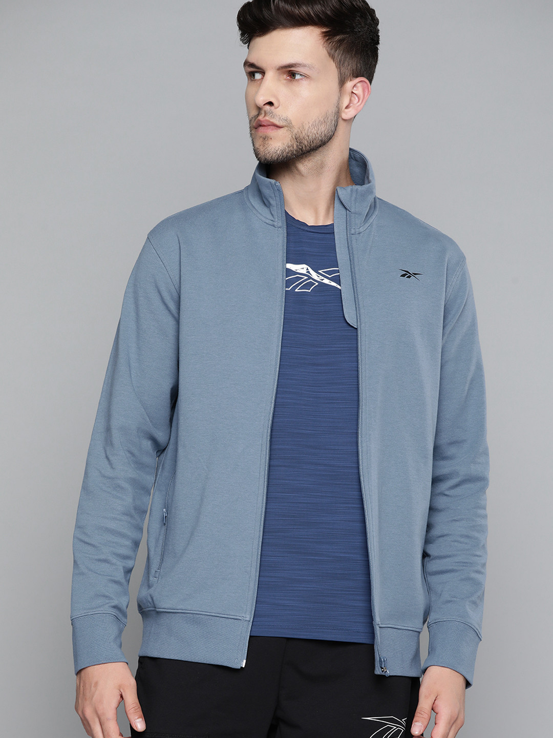 Buy Reebok Men Blue Solid Training Sporty Jacket - Jackets for Men ...