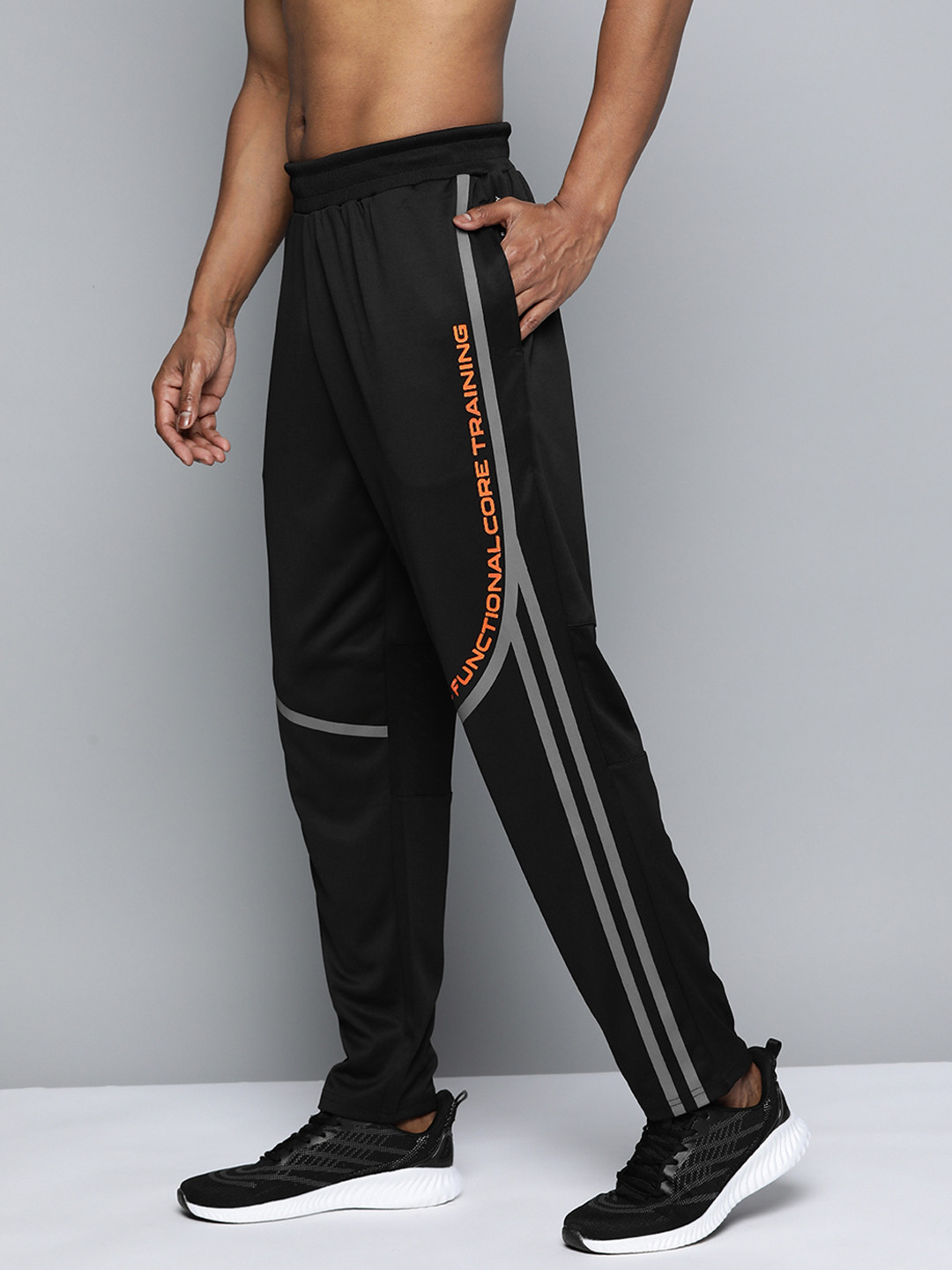 Buy HRX By Hrithik Roshan Training Men Rapid Dry Typography Track Pants ...