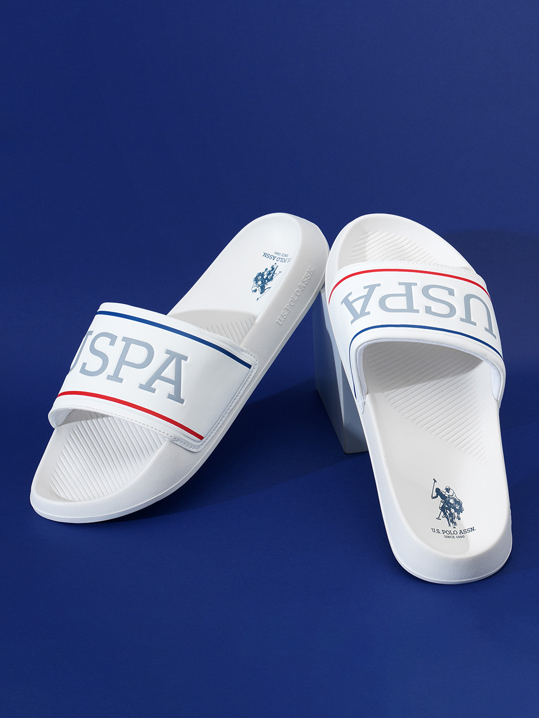 Buy U S Polo Assn Men White & Black Printed Sliders - Flip Flops for ...