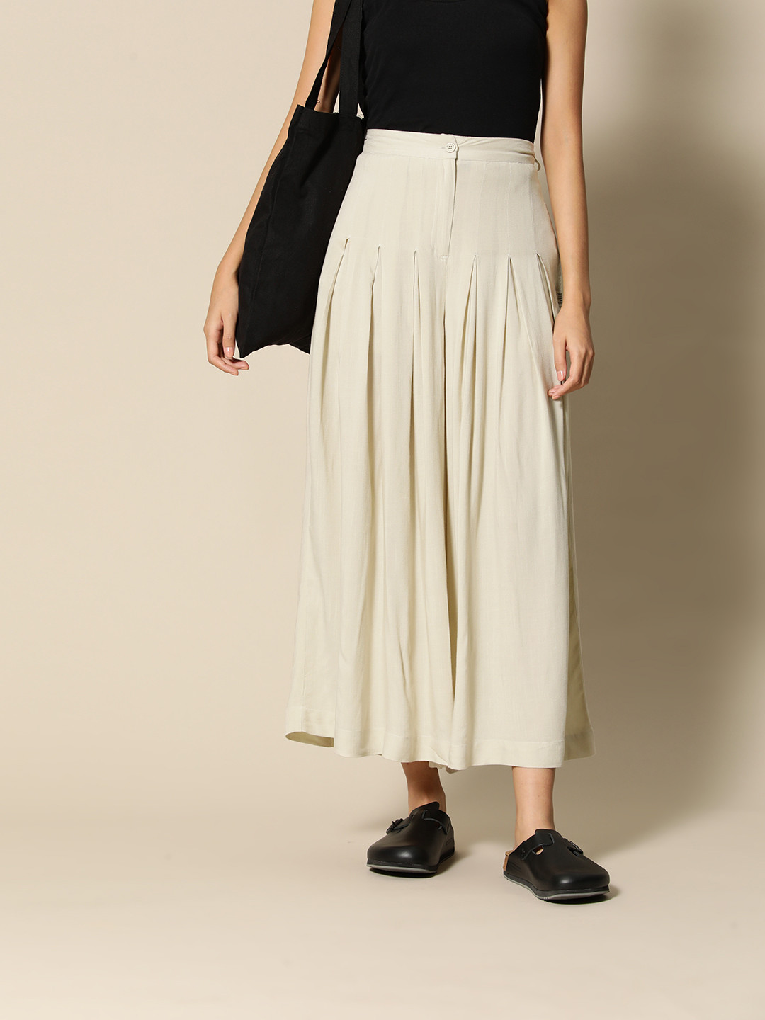 Buy BOWER Women Off White Solid Mid Rise Pleated Flared Trousers With ...