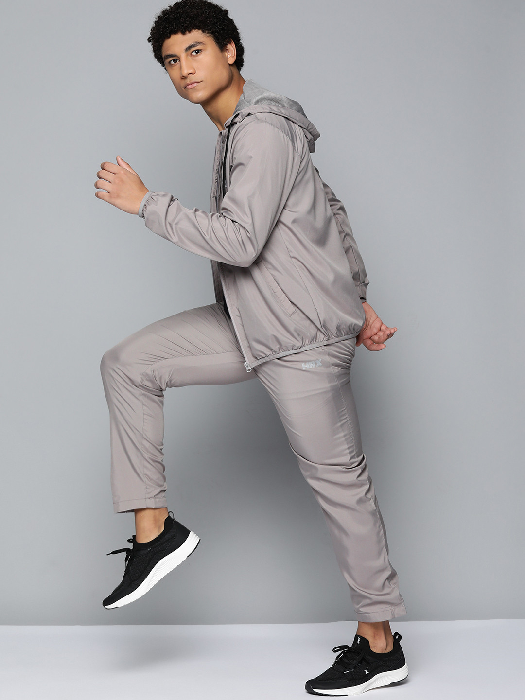 Buy HRX By Hrithik Roshan Men Grey Solid Running Tracksuit - Tracksuits ...