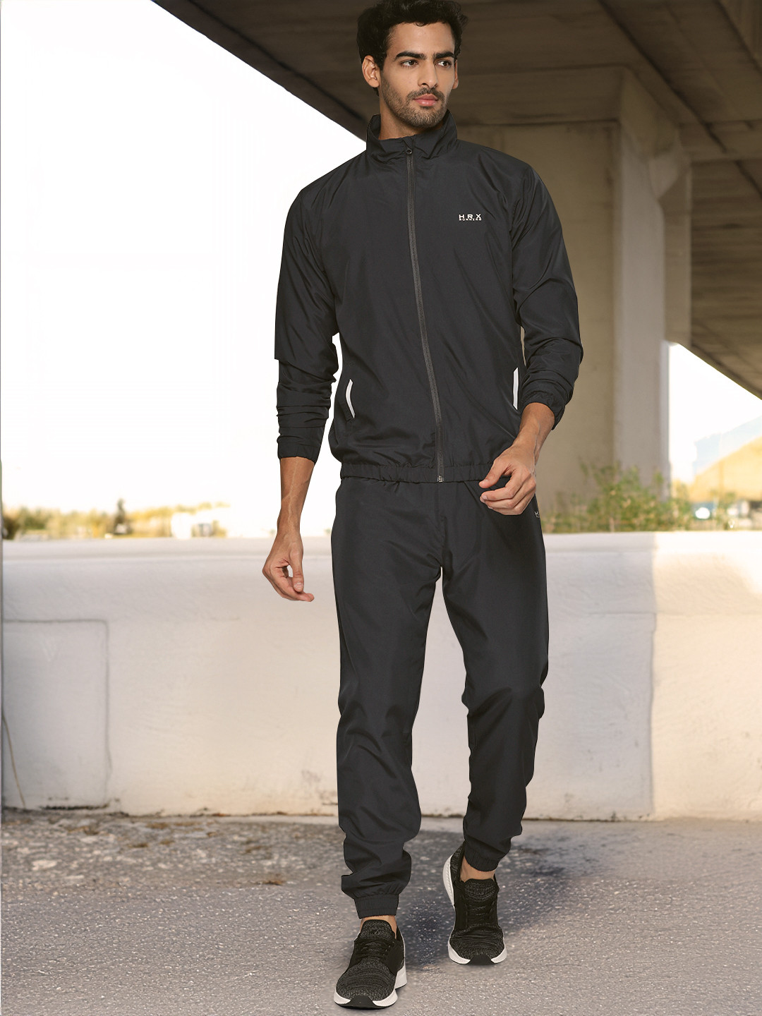 Buy HRX By Hrithik Roshan Men Navy Blue Solid Running Tracksuits ...