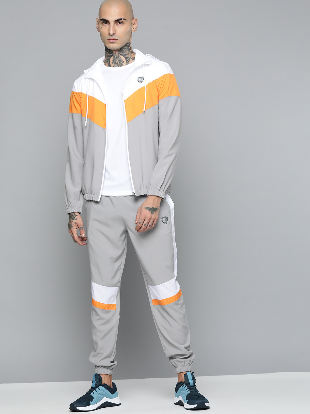 Buy HRX By Hrithik Roshan Men Grey & White Striped Rapid Dry Regular ...