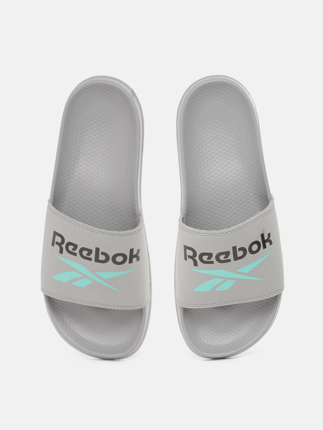 Buy Reebok Men Grey And Black Brand Logo Printed Sliders Flip Flops For Men 18516226 Myntra