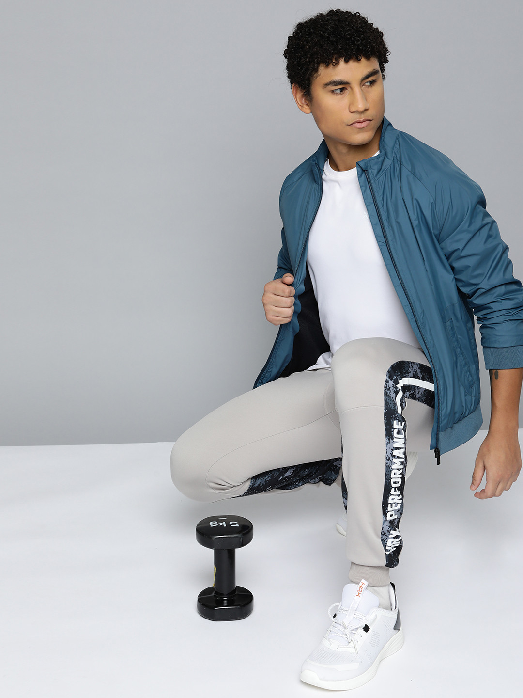 Buy HRX By Hrithik Roshan Men Teal Blue Solid Training Sporty Jacket ...