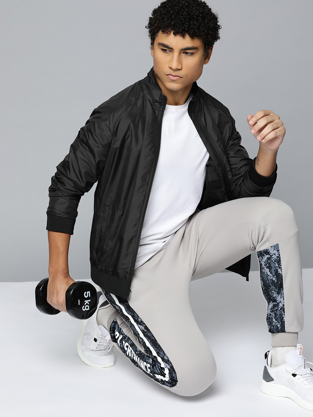 Buy HRX By Hrithik Roshan Men Black Solid Training Sporty Jacket ...