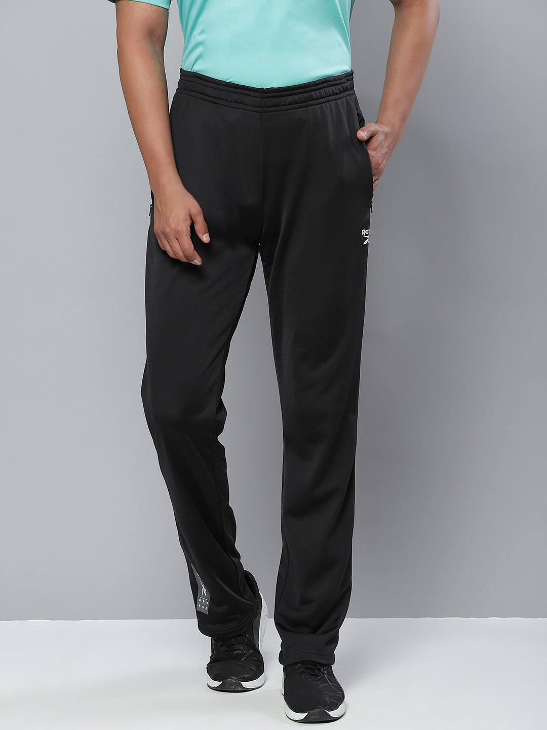 Buy Reebok Men Black Tag Performance Solid Track Pants - Track Pants ...