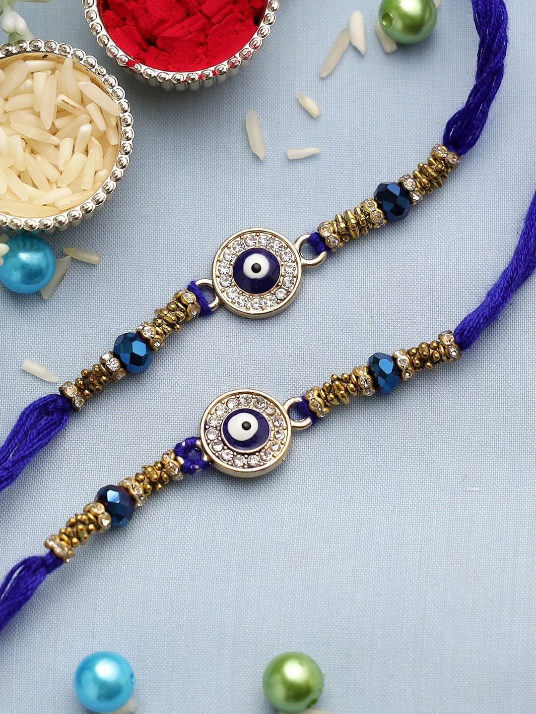 Buy Aapno Rajasthan Set Of 2 Blue & Gold Toned Evil Eye Rakhis - Rakhi ...
