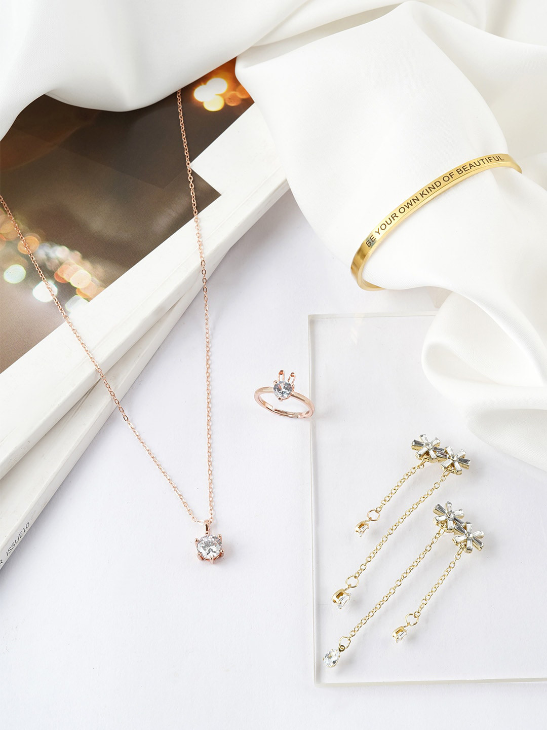 Buy JOKER & WITCH Gold Toned White Stone Studded Jewellery Set ...