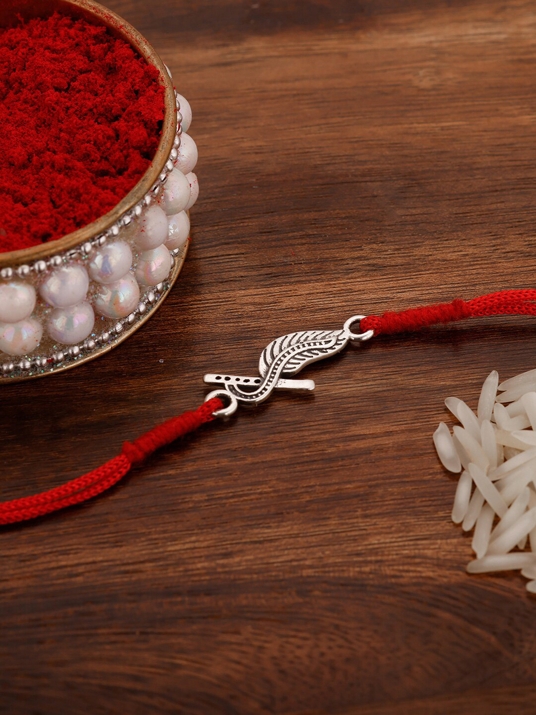 Buy GIVA Silver Toned 925 Sterling Silver Krishna Rakhi With Roli ...