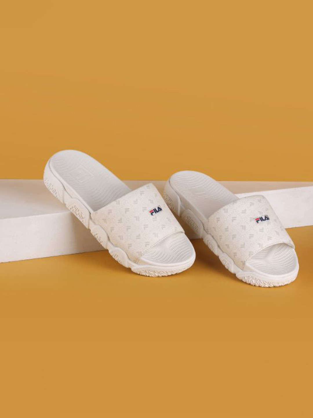Buy FILA Unisex EMBAR Printed Arch Support Sliders - Flip Flops for ...