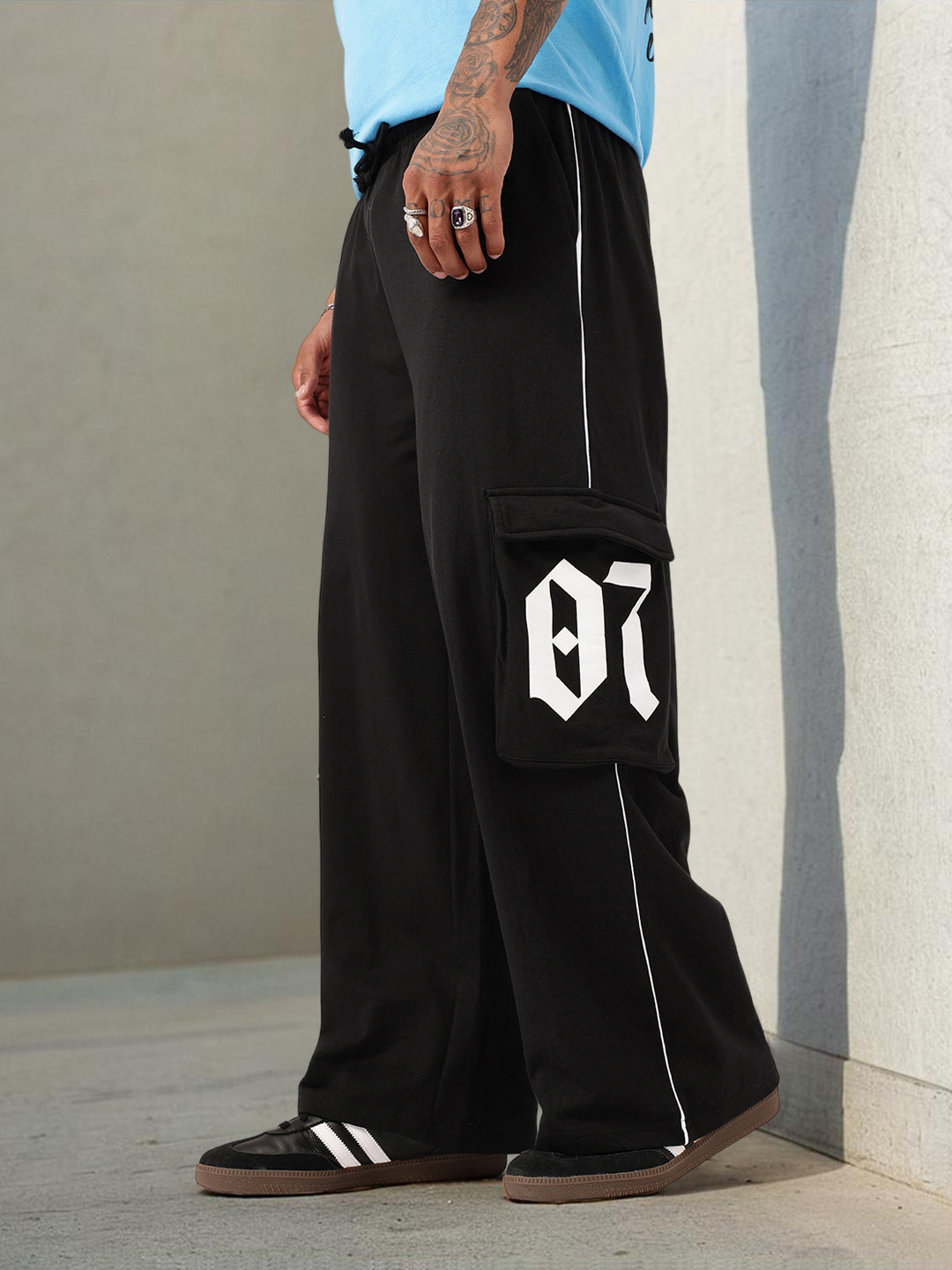 Buy Kook N Keech Men Sporty Typography Printed Flared Fit Track Pants ...