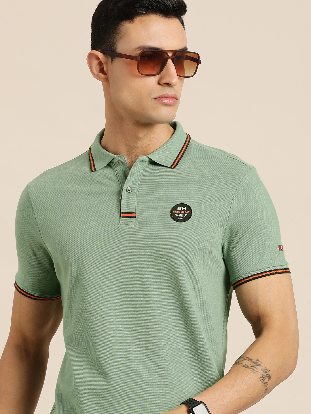 Buy Being Human Men Green Solid Polo Collar Pure Cotton Brand Logo ...