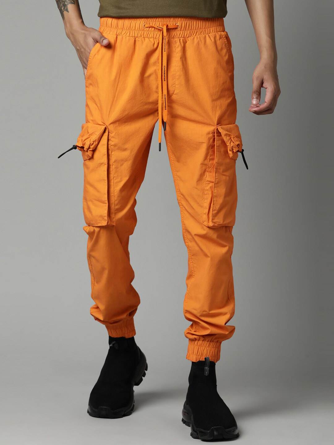 Buy Breakbounce Men Orange Solid Slim Fit Cotton Cargo Joggers ...
