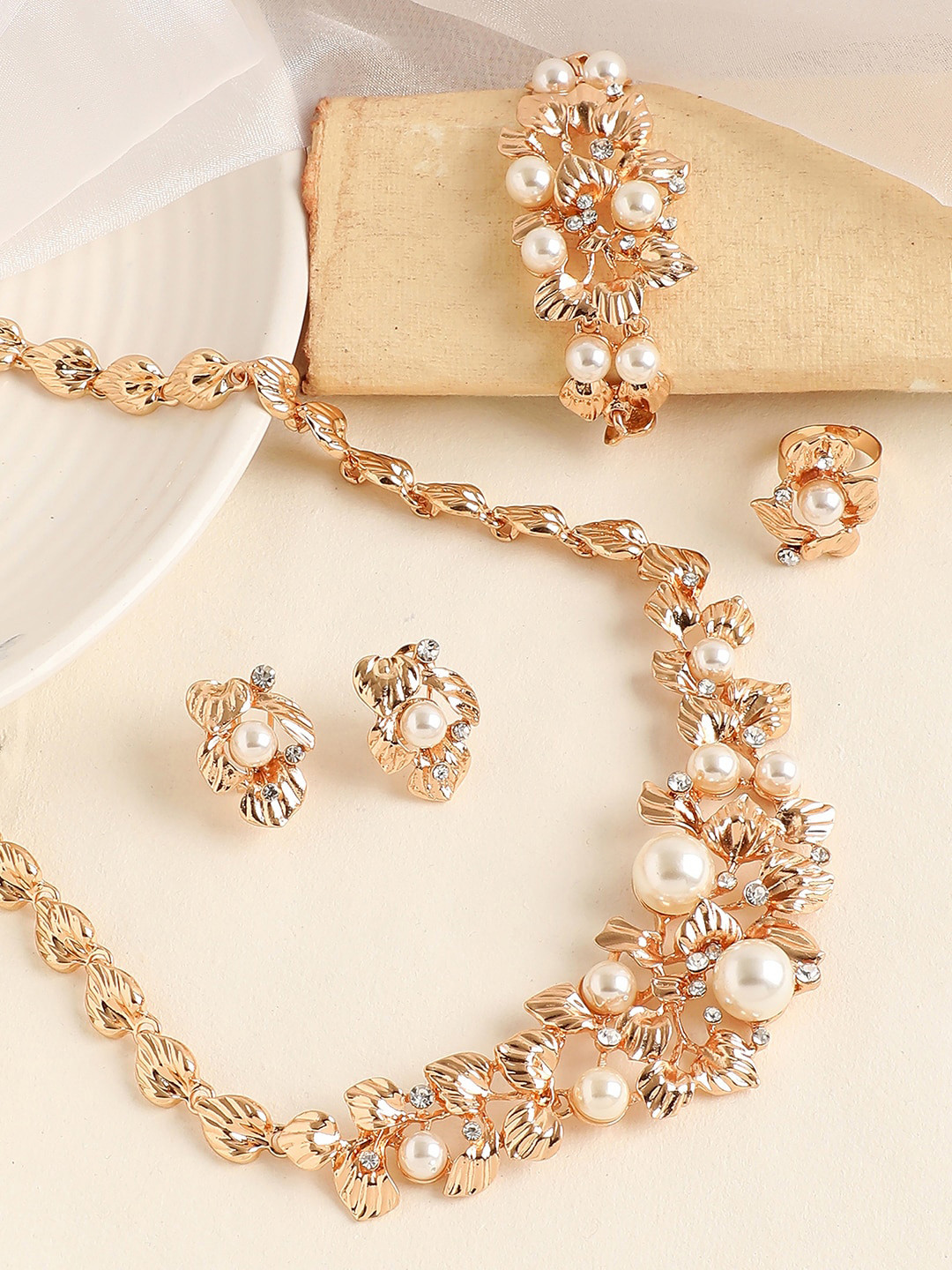 Buy SOHI Gold Plated White Stone Studded & Pearls Beaded Jewellery Set ...