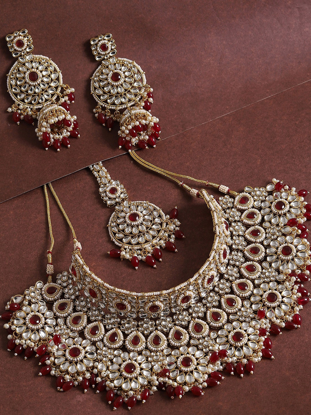 Buy SOHI Gold Plated Maroon & White Stone Studded Jewellery Set ...