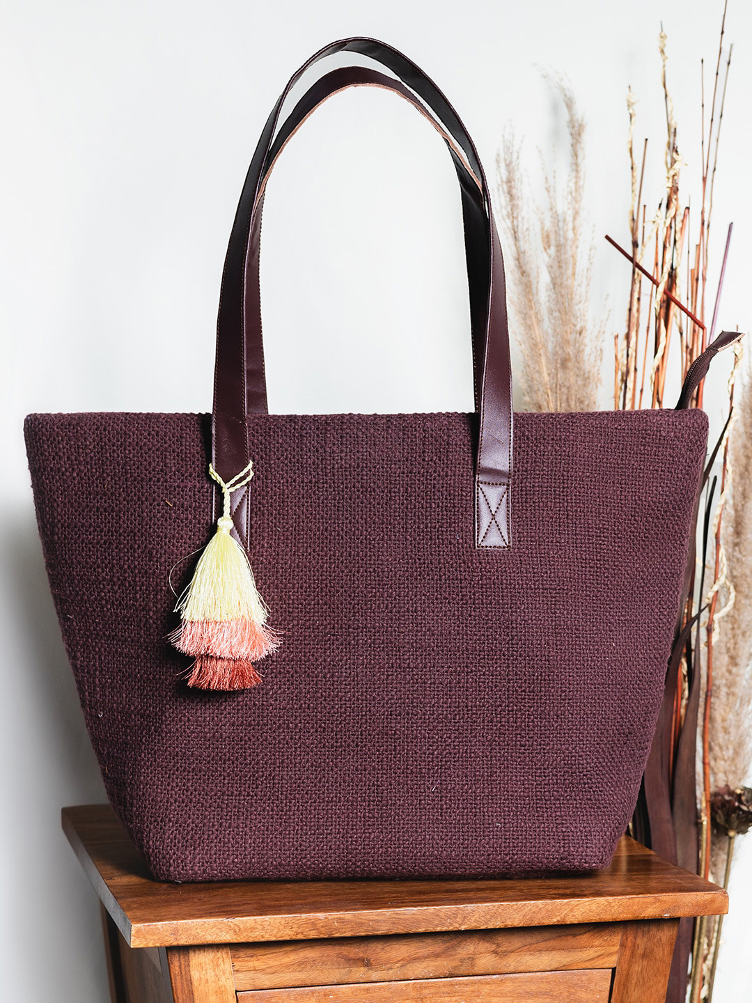 Buy DEEBACO Brown Textured Structured Tote Bag With Tasselled ...