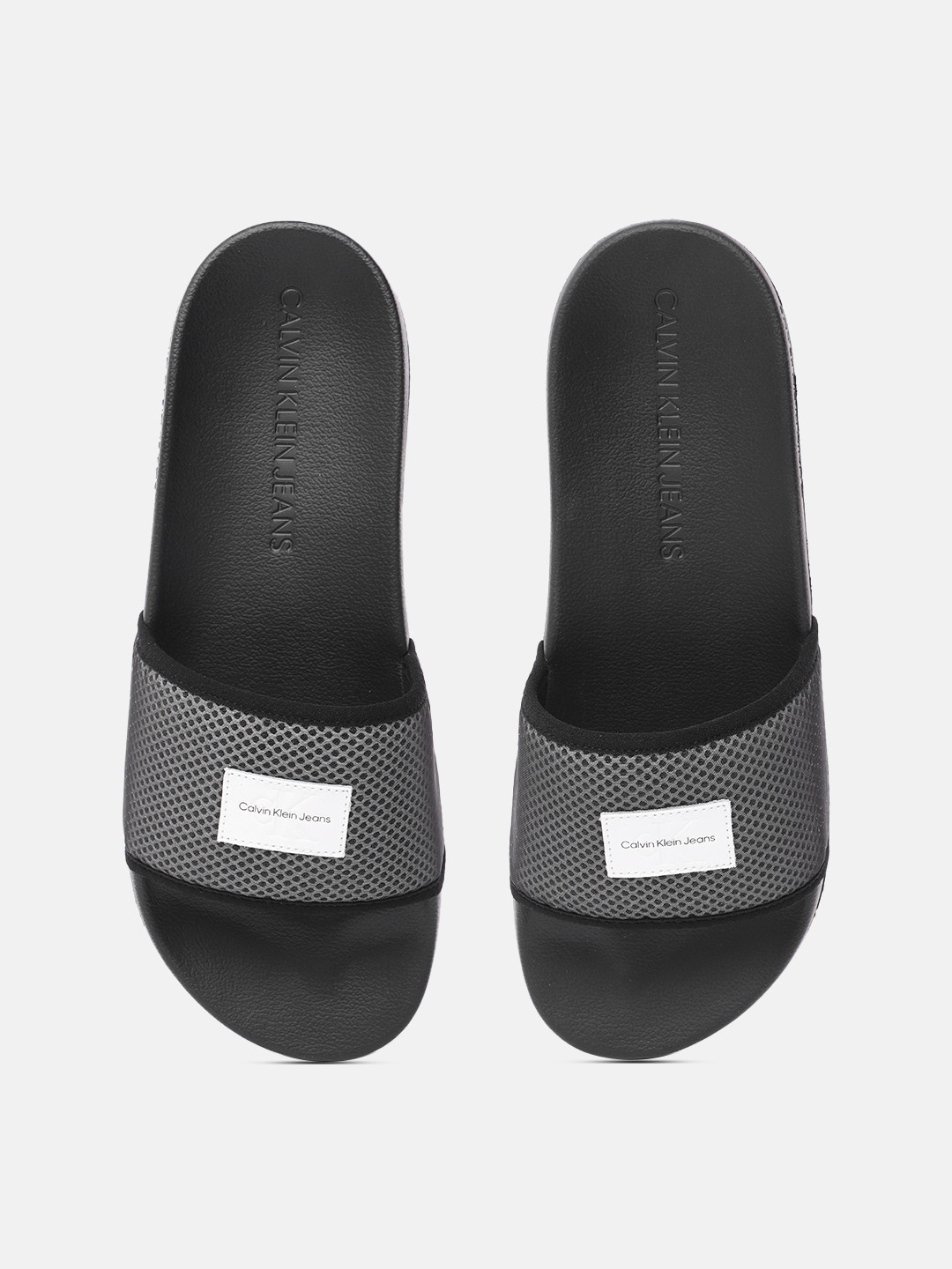 Buy Calvin Klein Jeans Men Textured Self Design Sliders With Brand Logo ...