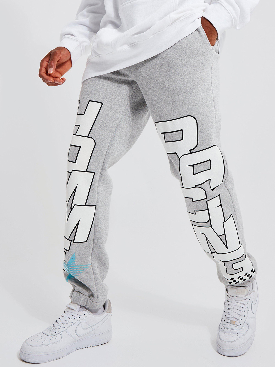 Buy BoohooMAN Racing Puff Print Jogger - Track Pants for Men 22029680 ...