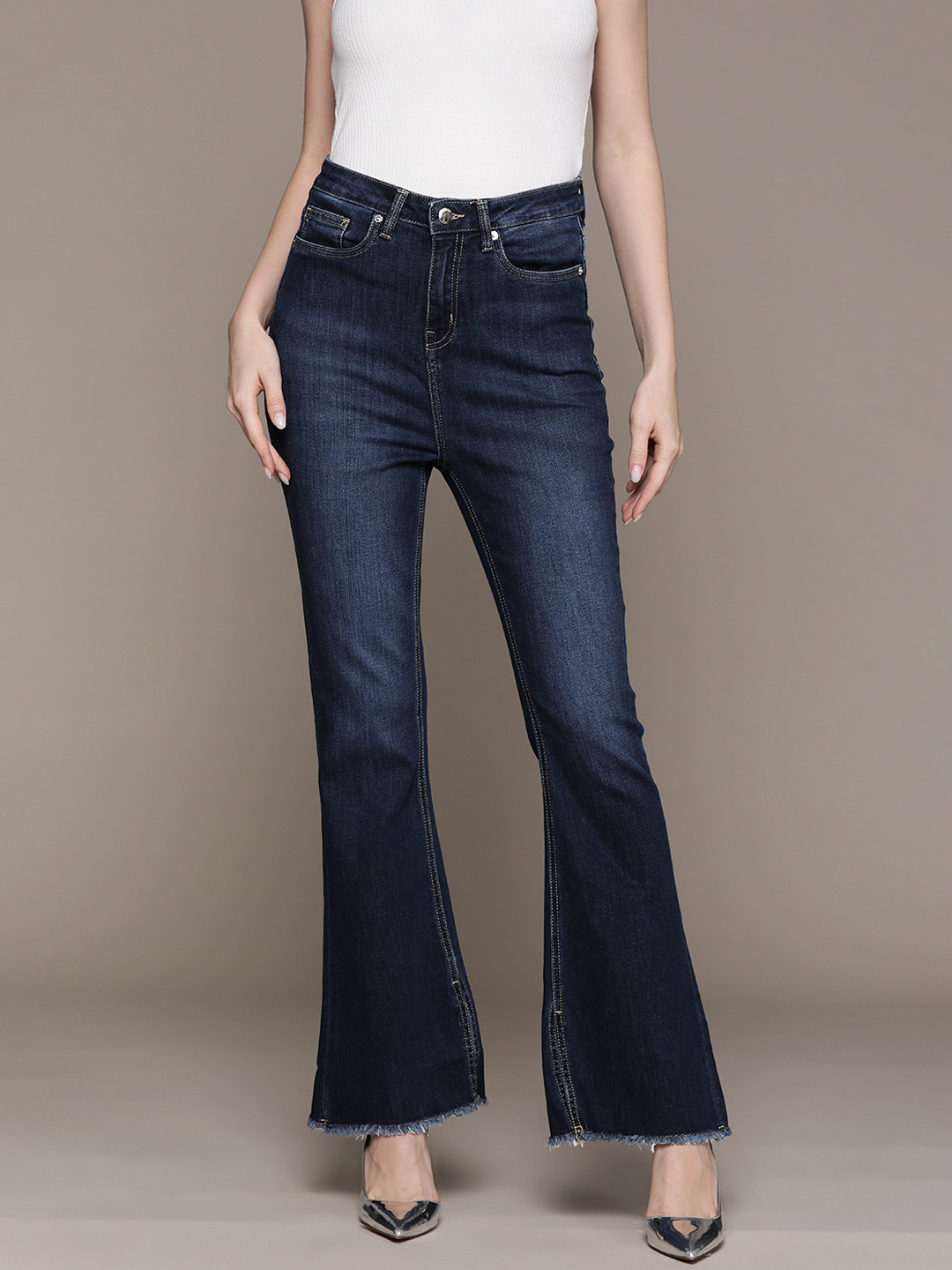 Buy Bebe Women Denim Daze Frayed Hem Bootcut Light Fade Stretchable ...