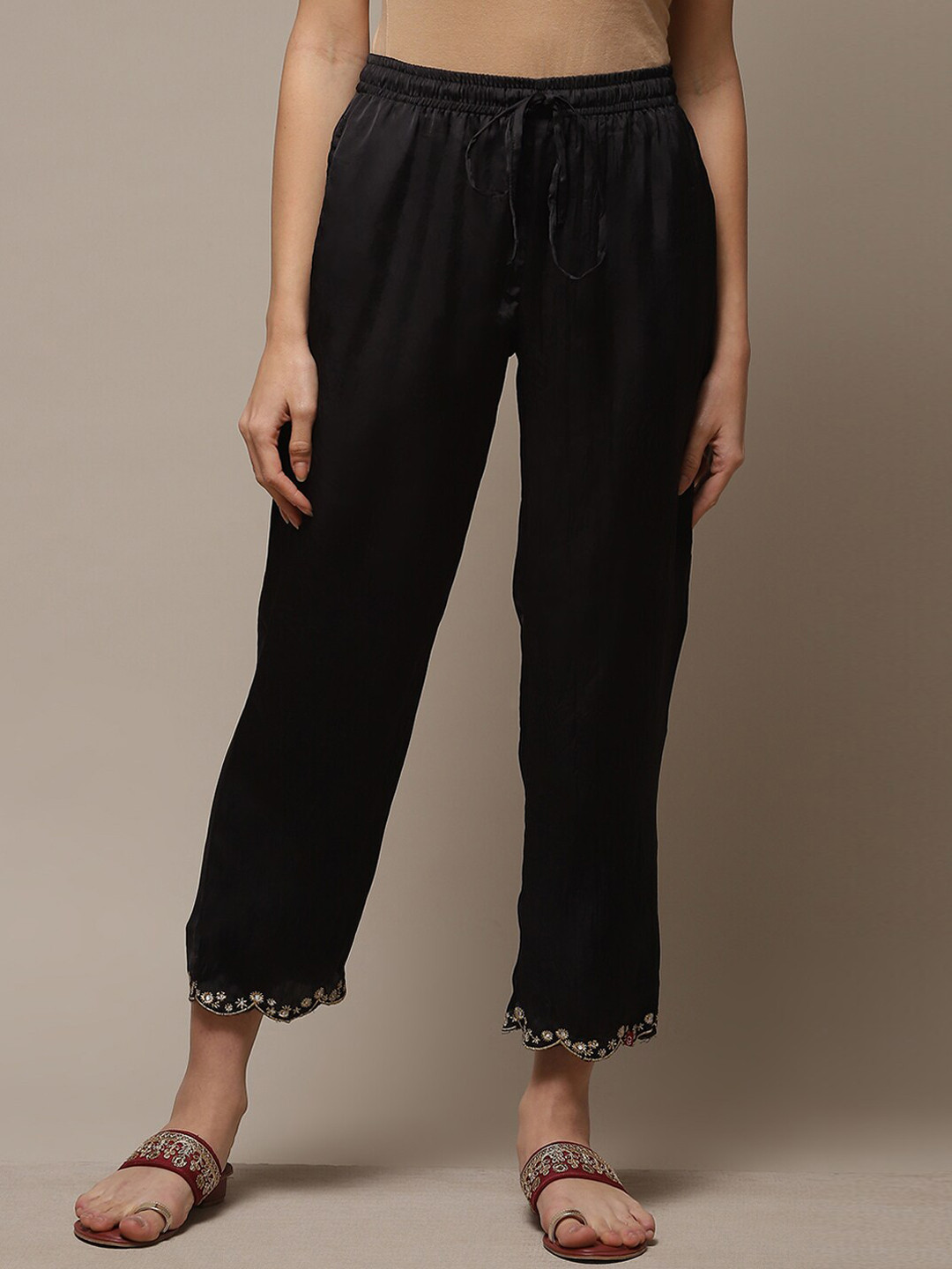 Buy Biba Women Relaxed Embellished Hemline Pleated Regular Trousers ...