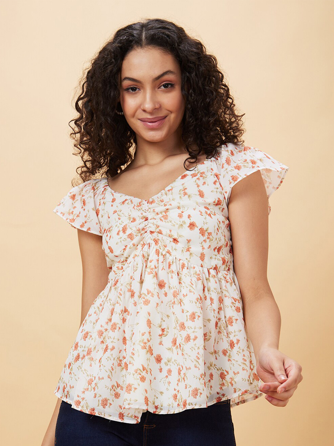 Buy Globus White Floral Printed V Neck Smocked Detailed Empire Top ...