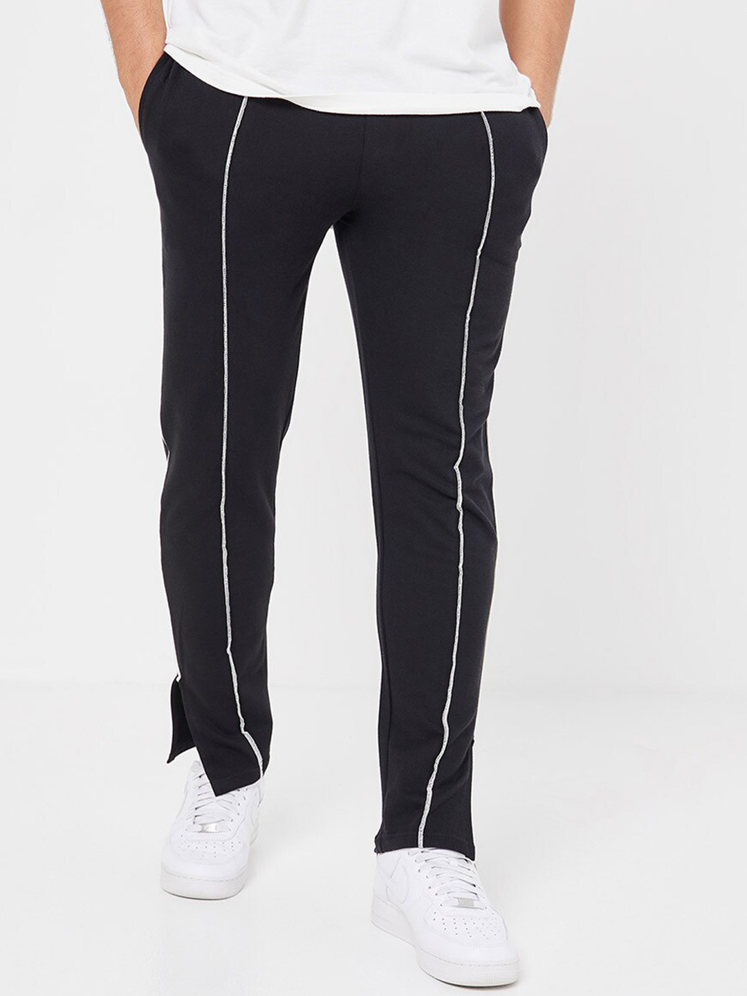 Buy Styli Men Black Front Striped Side Slit Slim Fit Track Pants ...