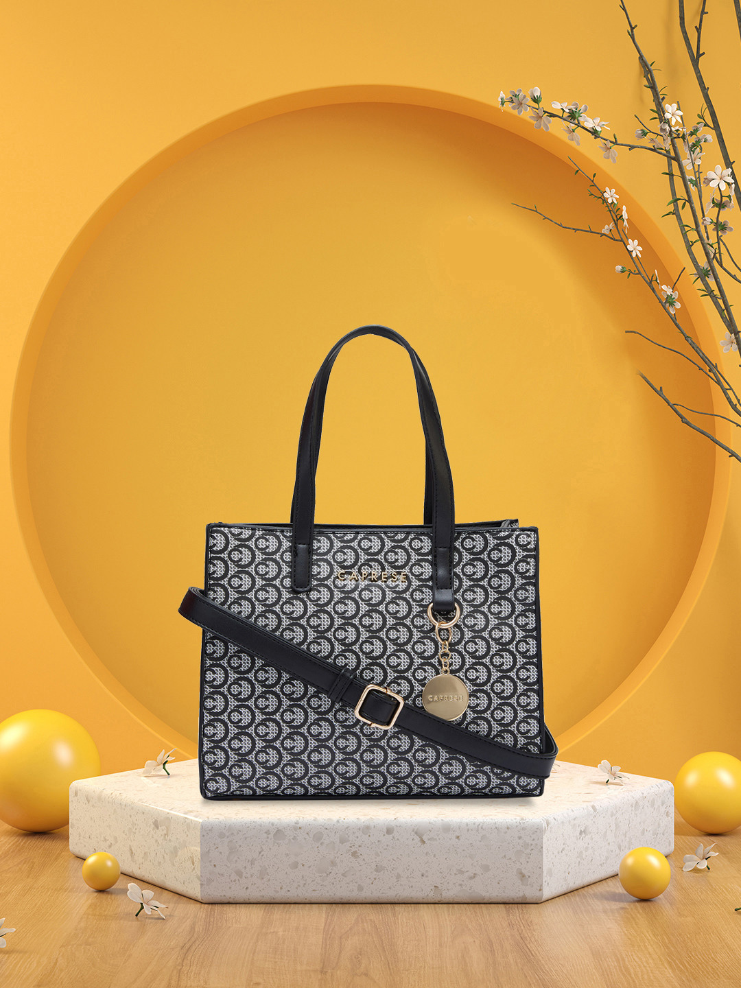 Buy Caprese Brand Logo Printed Leather Structured Handheld Bag ...
