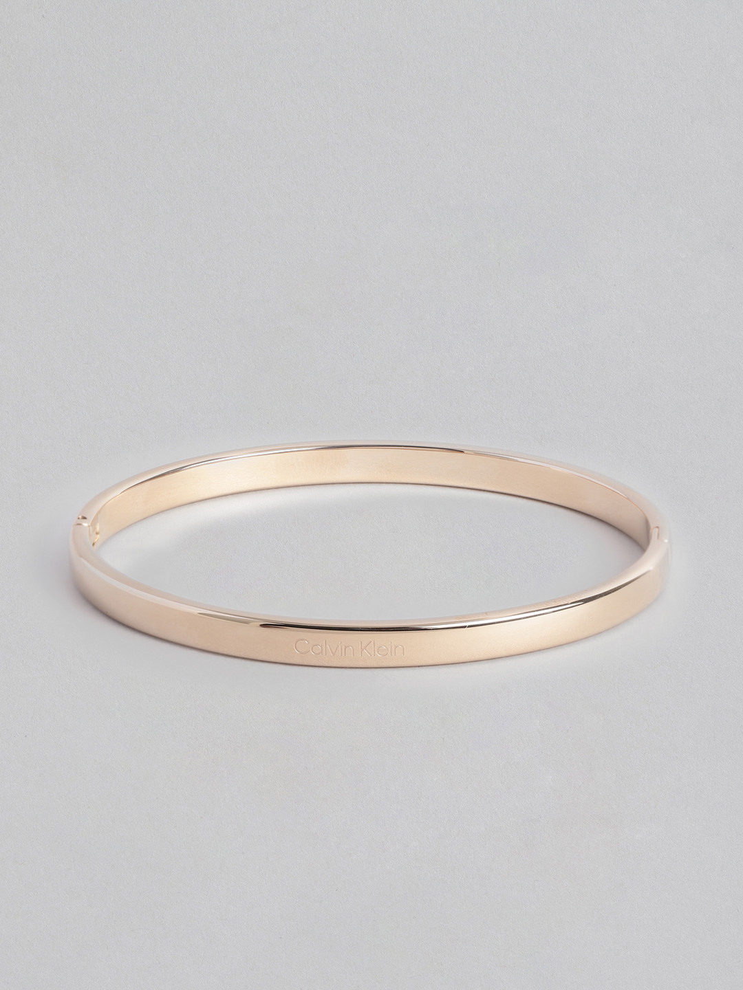 Buy Calvin Klein Pursi Brass Plated Oval Shaped Bangle - Bangle for ...