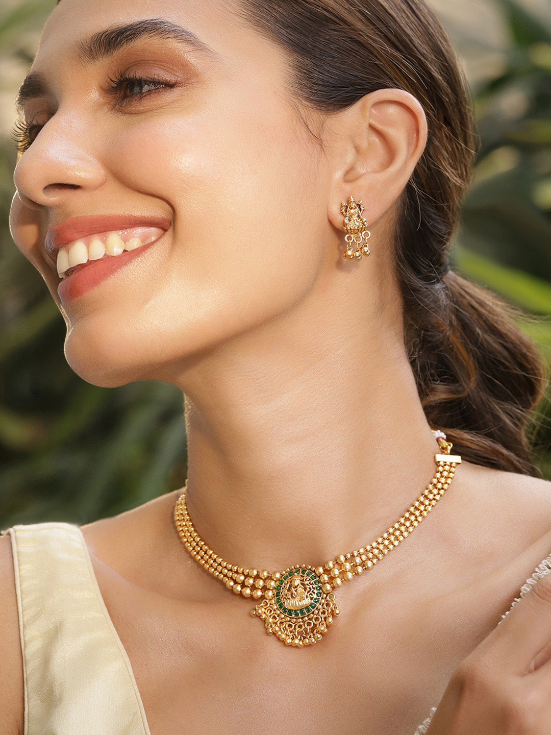 Buy Rubans 22K Gold Plated Emerald Studed Gold Beaded Goddess Laxmi Motif Temple Jewellery Set ...