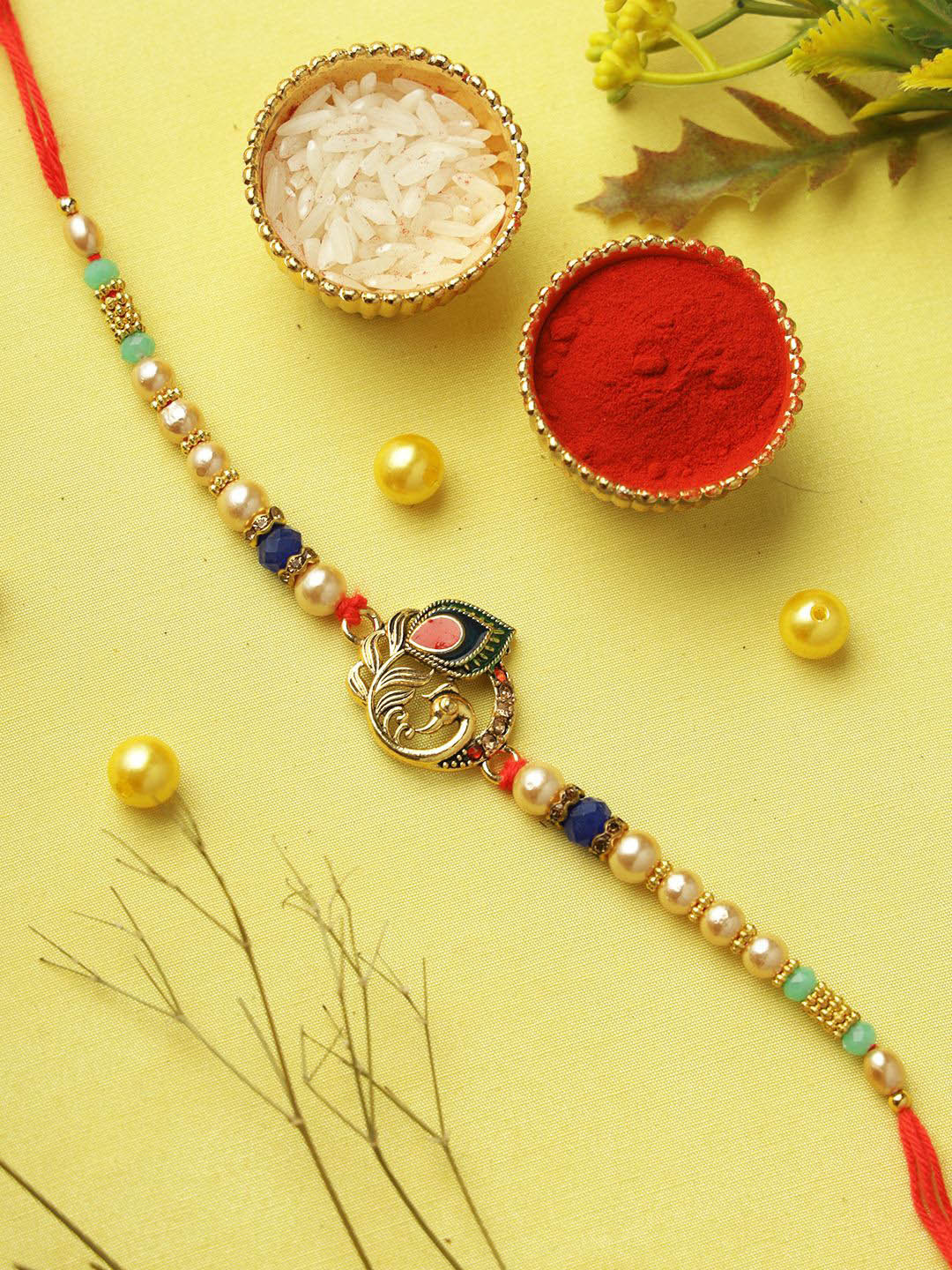 Buy Aapno Rajasthan Peacock Feather Pearl Beaded Rakhi With Roli Chawal ...