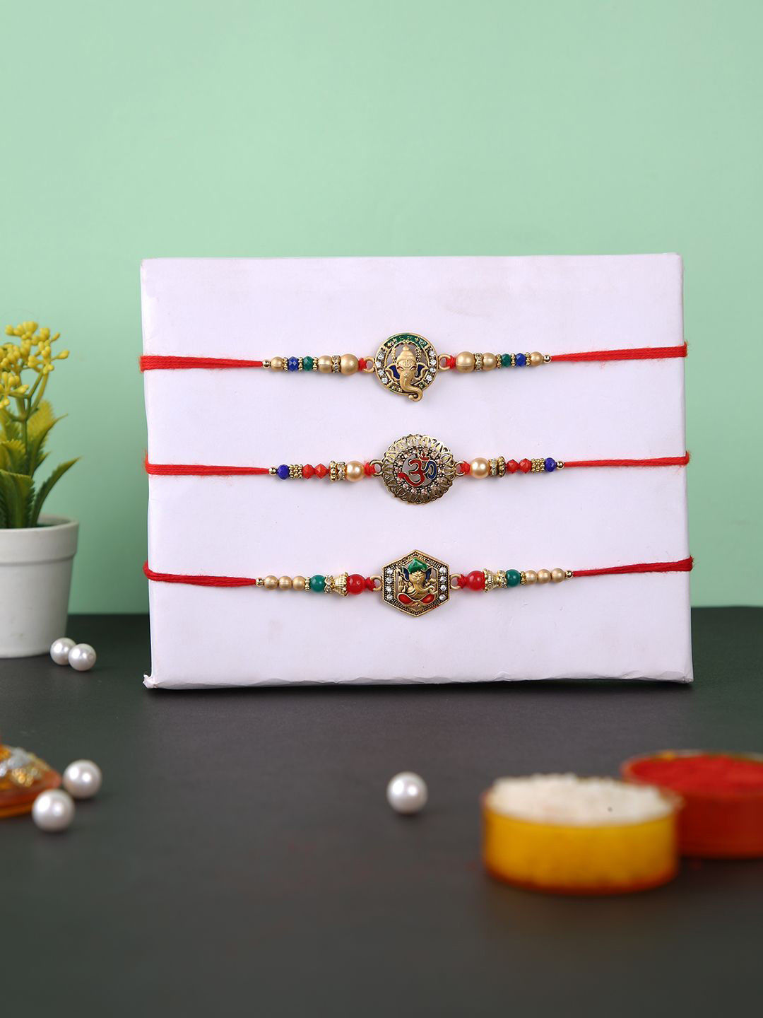 Buy Aapno Rajasthan Set Of 3 Ganesha & Om Stone Studded & Beaded Rakhis ...