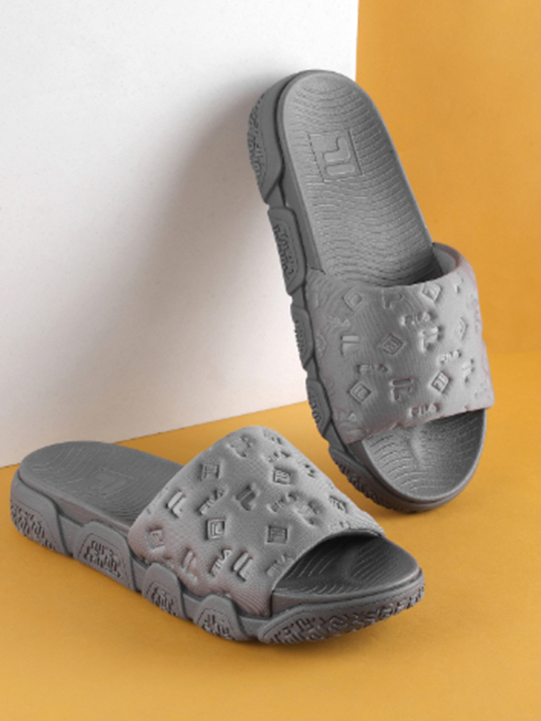 Buy FILA Unisex CANDOR Self Design Sliders - Flip Flops for Unisex ...